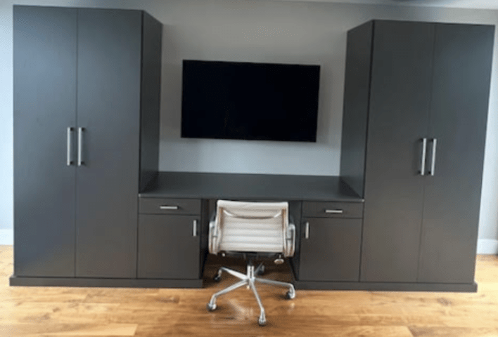Desk Area with Cabinets and Mounted TV - Chicagoland Home Products